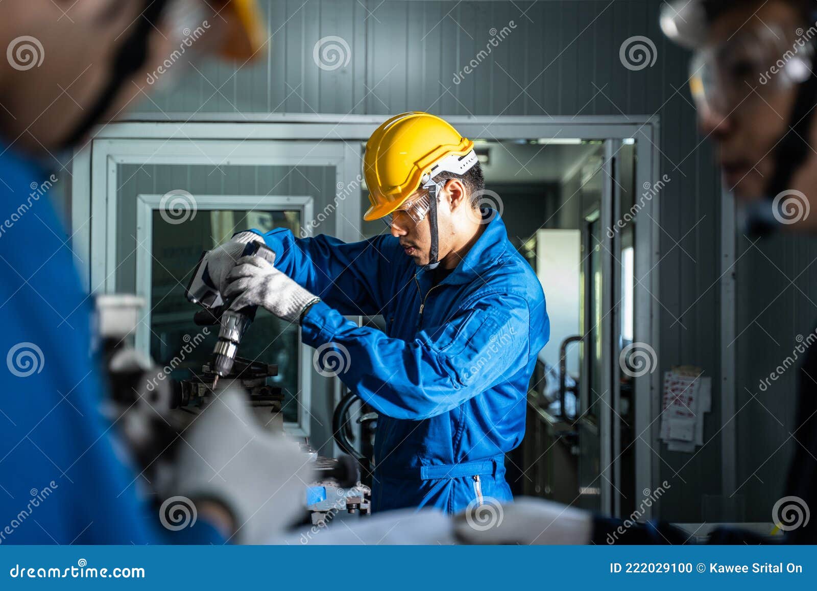 Asian Mechanical Workers Working on Milling Machine. the Technicians ...