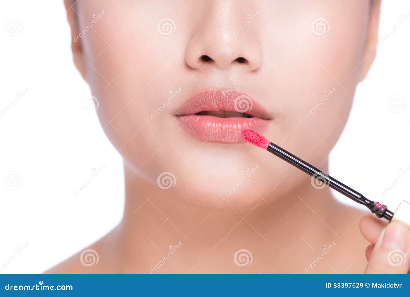 Asian Model Applying Lips Gloss Isolated on White Background. Stock ...