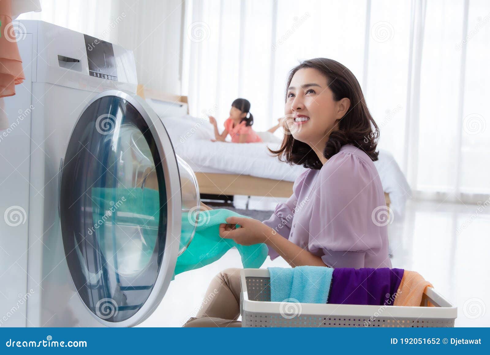 Asian Mom Loading Cloth To Washing Machine Doing Laundry Stock Photo ...