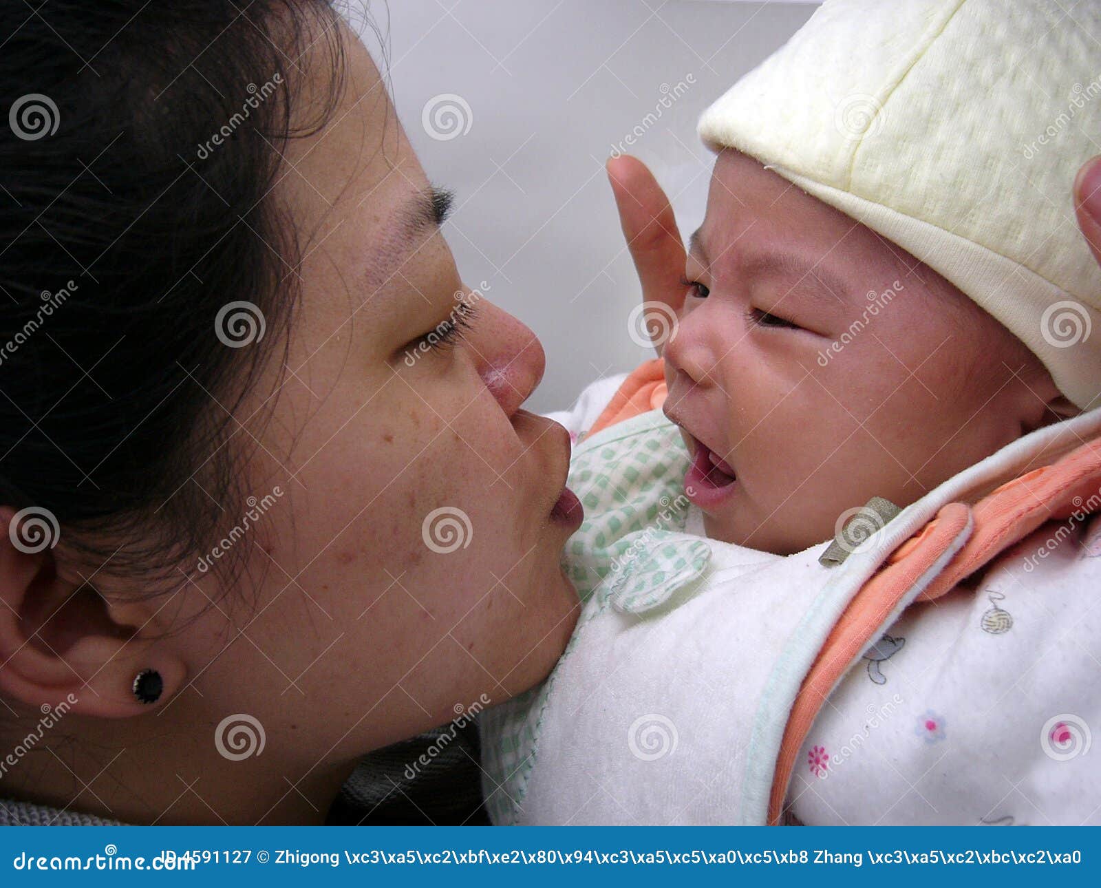 Asian Mother and Daugher Murmuring Stock Image - Image of kiss, women ...