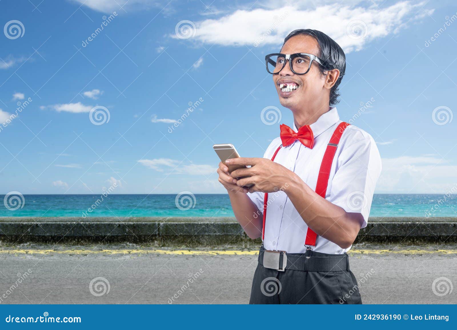 Asian Nerd with an Ugly Face Holding Mobile Phone Stock Photo - Image ...