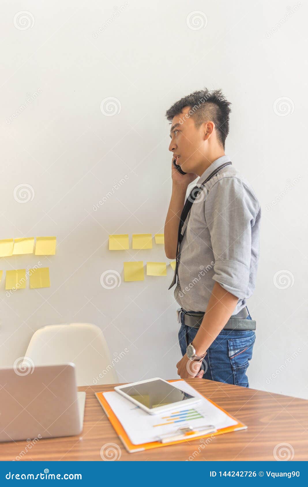 Asian Office Man Answer the Phone Call in the Office Stock Photo ...