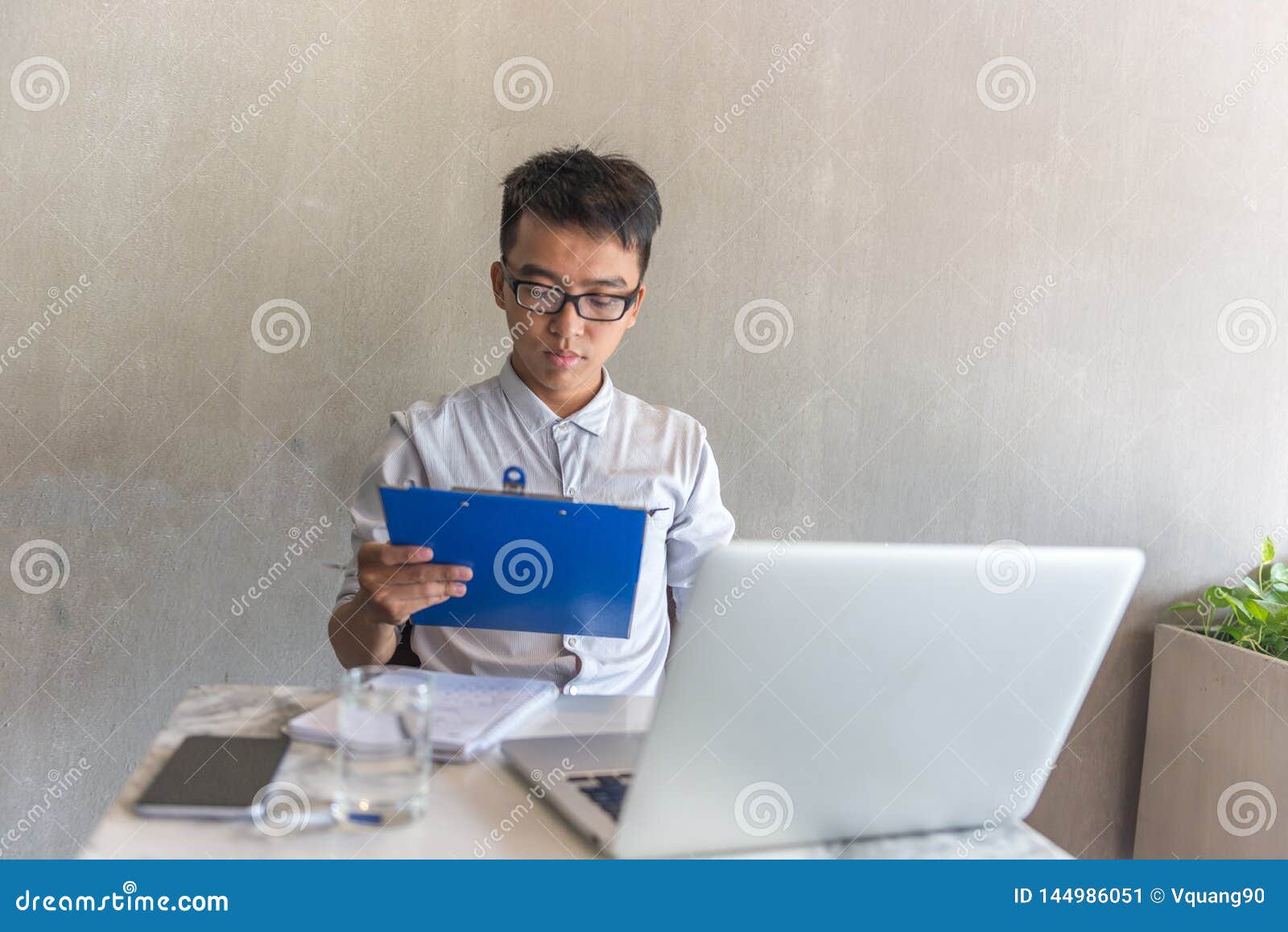 Asian Office Man Reading Financial Data on Report Stock Image - Image ...