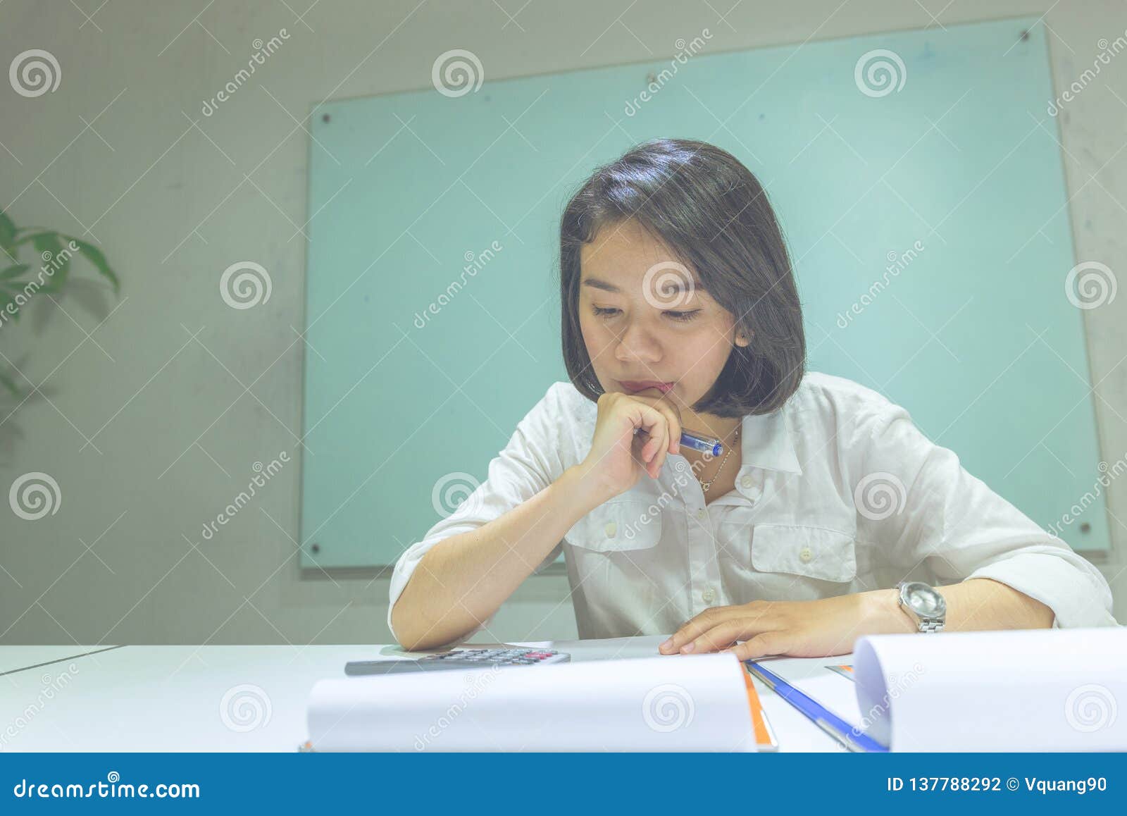 Asian Office Manager Checking Information on Report Stock Photo - Image ...