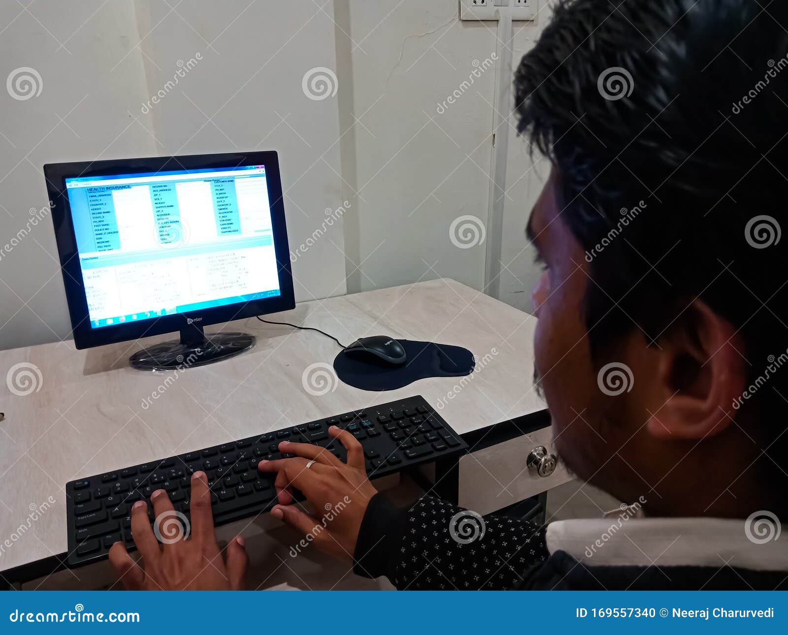 An Asian Office Staff Male Executive Working at Desktop Computer in ...