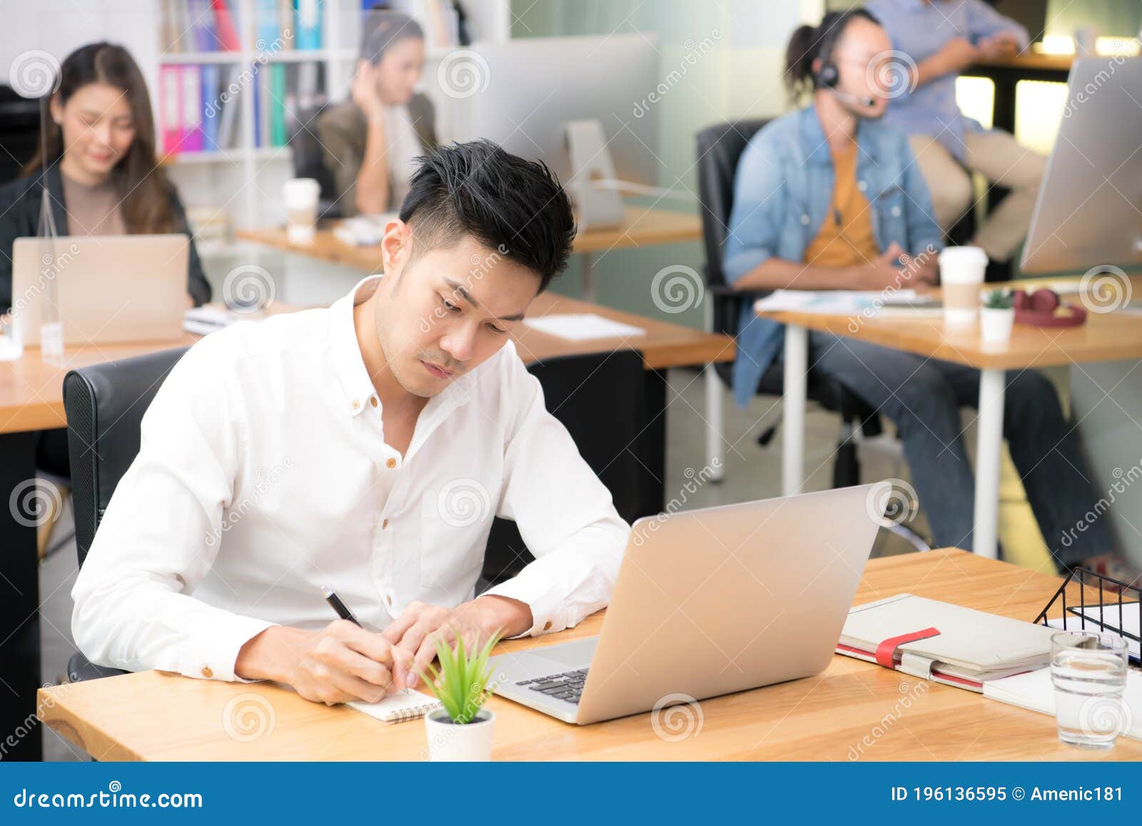 Asian Office Workers Working on Laptops and Computers in the Office ...