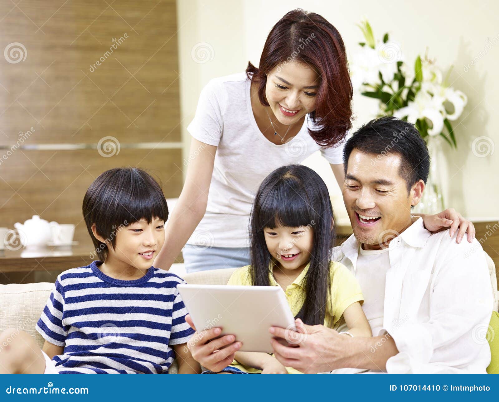 Asian Family with Two Children Using Digital Tablet Together Stock ... Asian Family with Two Children Using Digital Tablet Together Stock ...