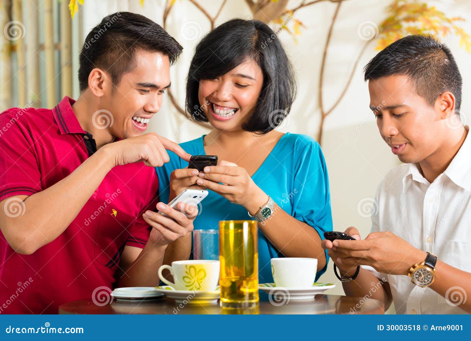 Asian People Having Fun with Mobile Phone Stock Photo - Image of ...