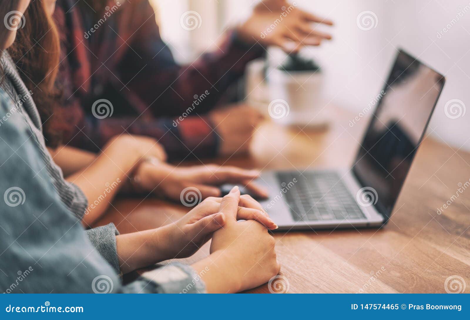 Asian People Using and Looking at the Same Laptop Computer during a ...