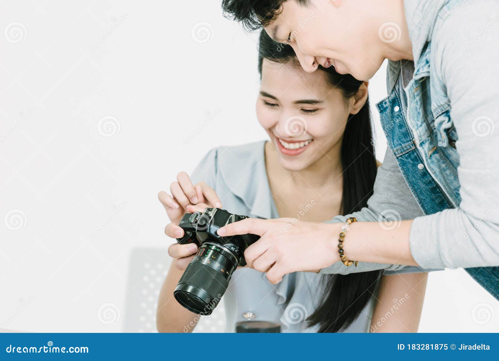 Asian Photographer and Model Looking Pictures from Back Screen of ...
