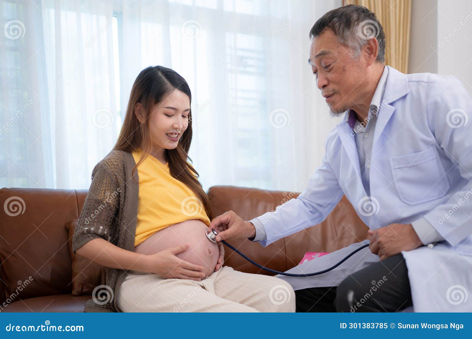 Asian Pregnant Woman Visit Gynecologist Doctor At Medical Clinic For