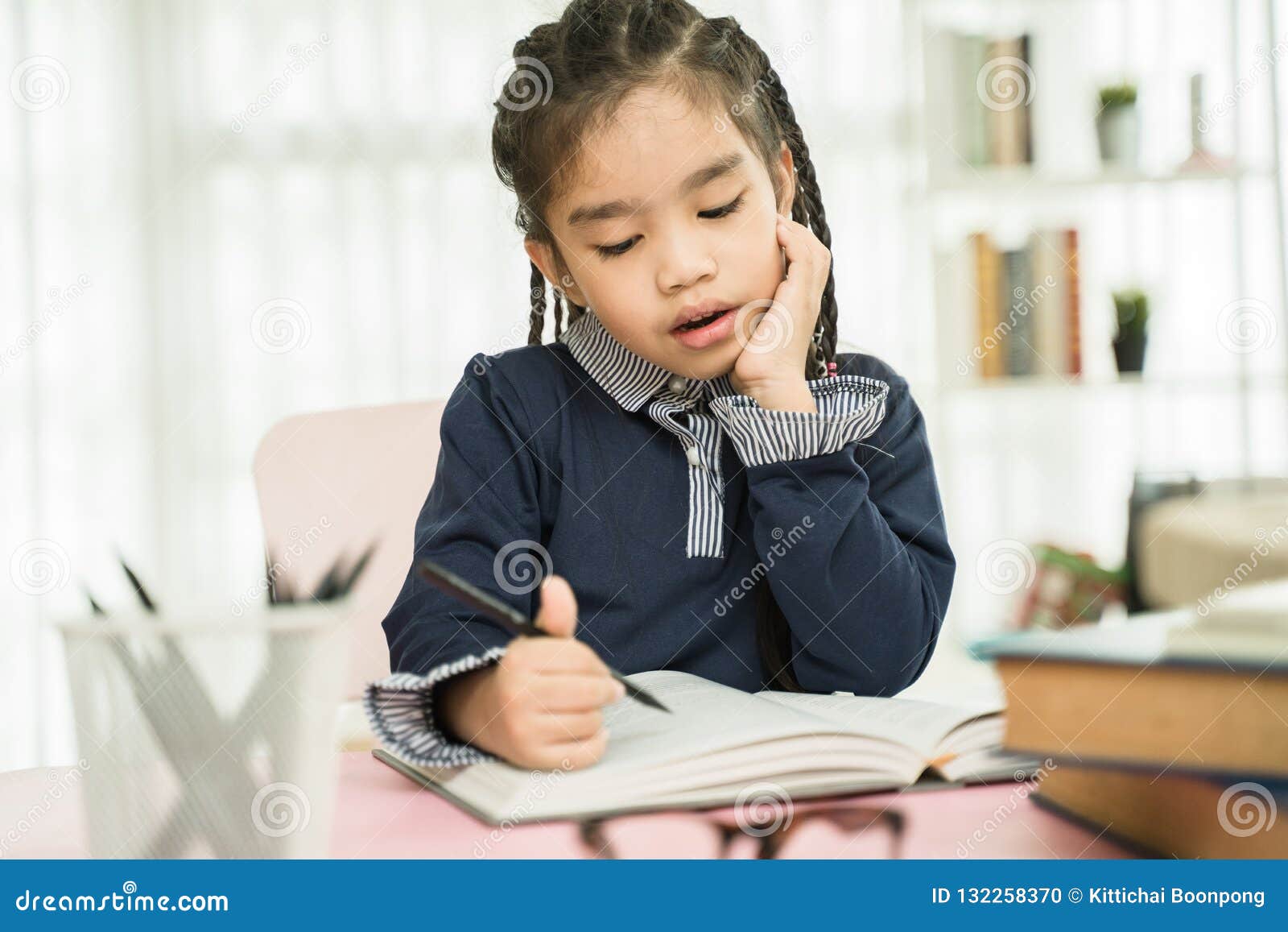 Asian Primary School Student Studying Homework in Home Stock Photo ...