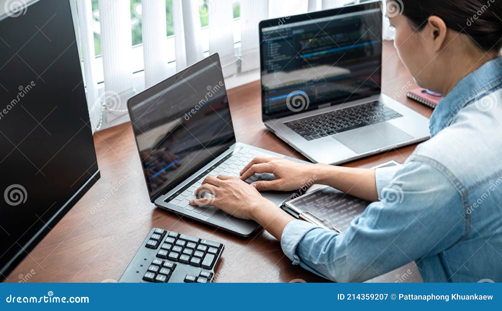 Asian Programmer Woman Looking on Multiple Computer Screen To Typing ... Asian Programmer Woman Looking on Multiple Computer Screen To Typing ...