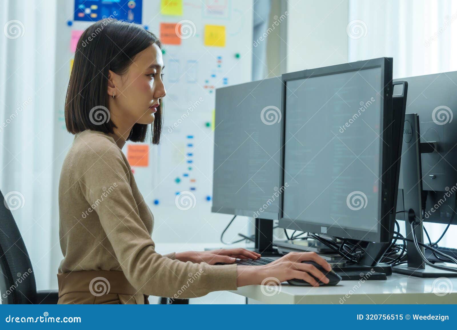 Asian Prompt Engineer Develop Coding App with Software Data Sitting in ...