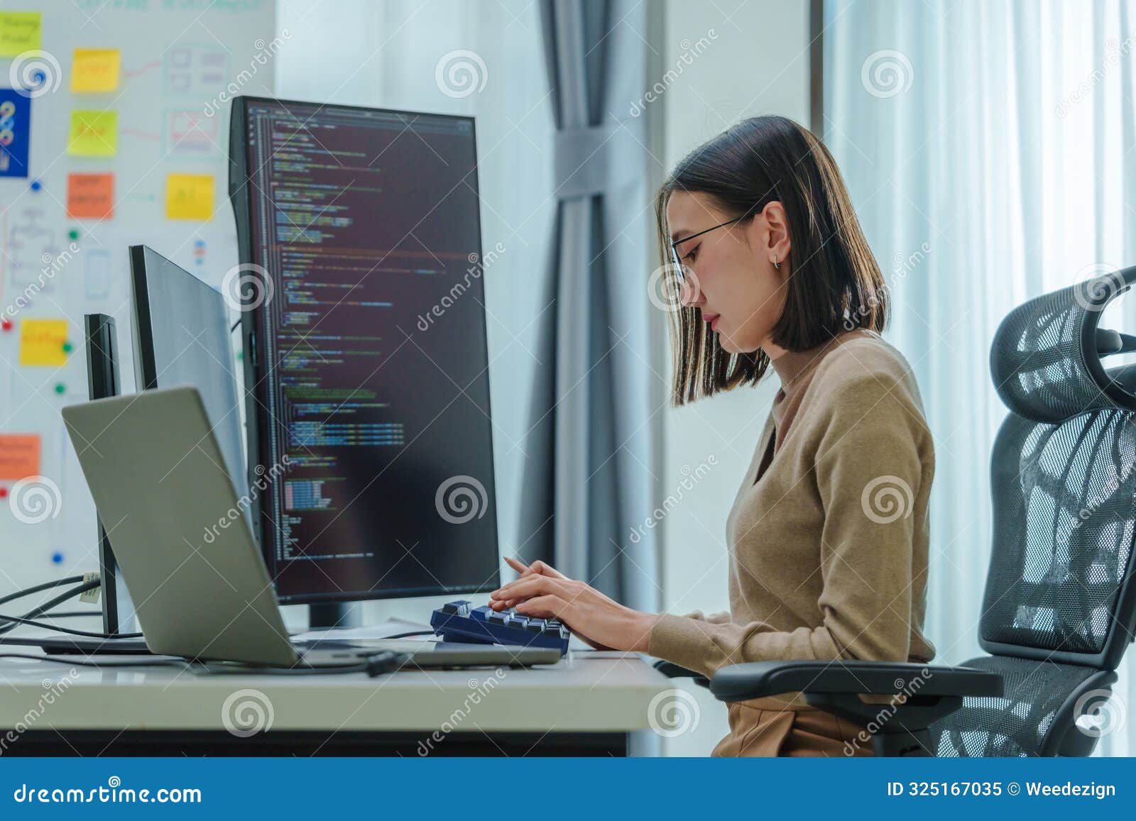 Asian Prompt Engineer Develop Coding App with Software Data Sitting in Front of Computer Monitor ...