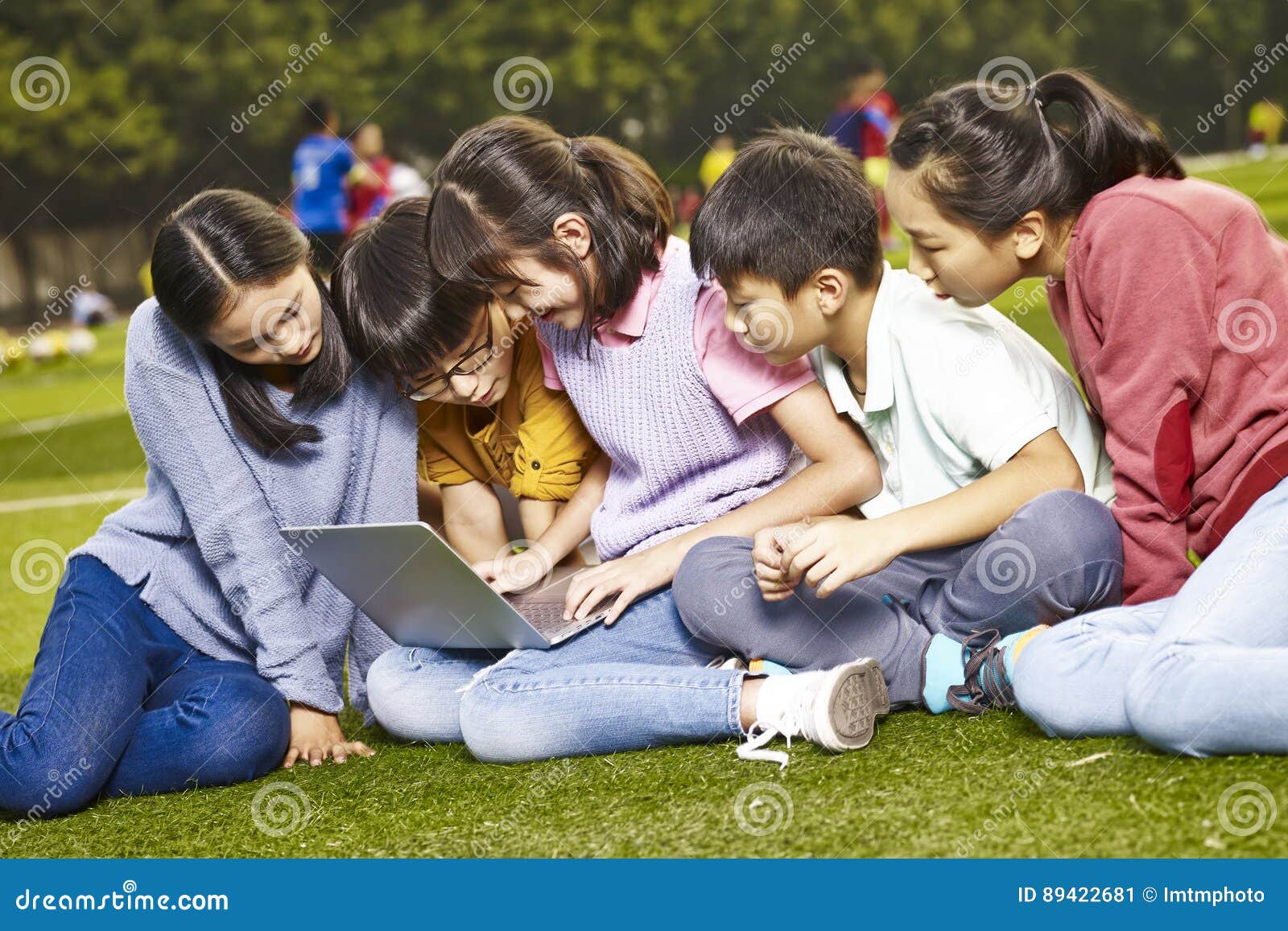Asian Pupil Using a Laptop Outdoors Stock Image - Image of kong, ground ...