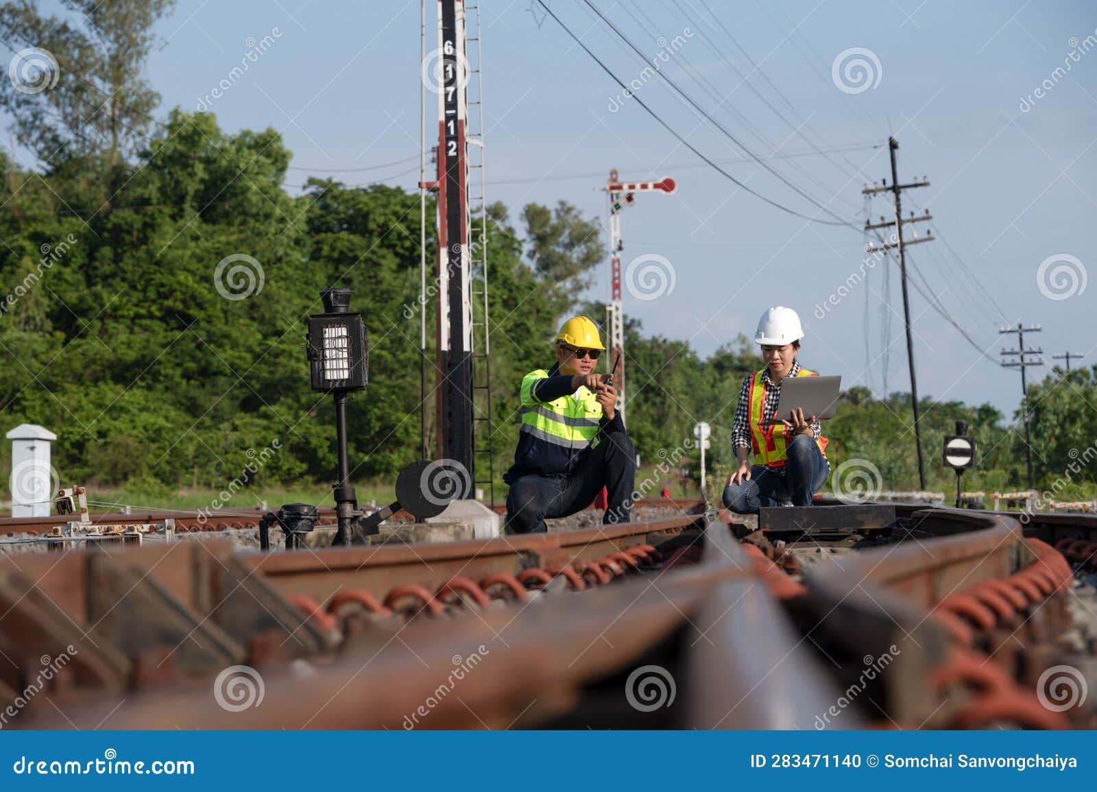 Asian Railway Engineer Inspects a Train Station Engineer Working on ...