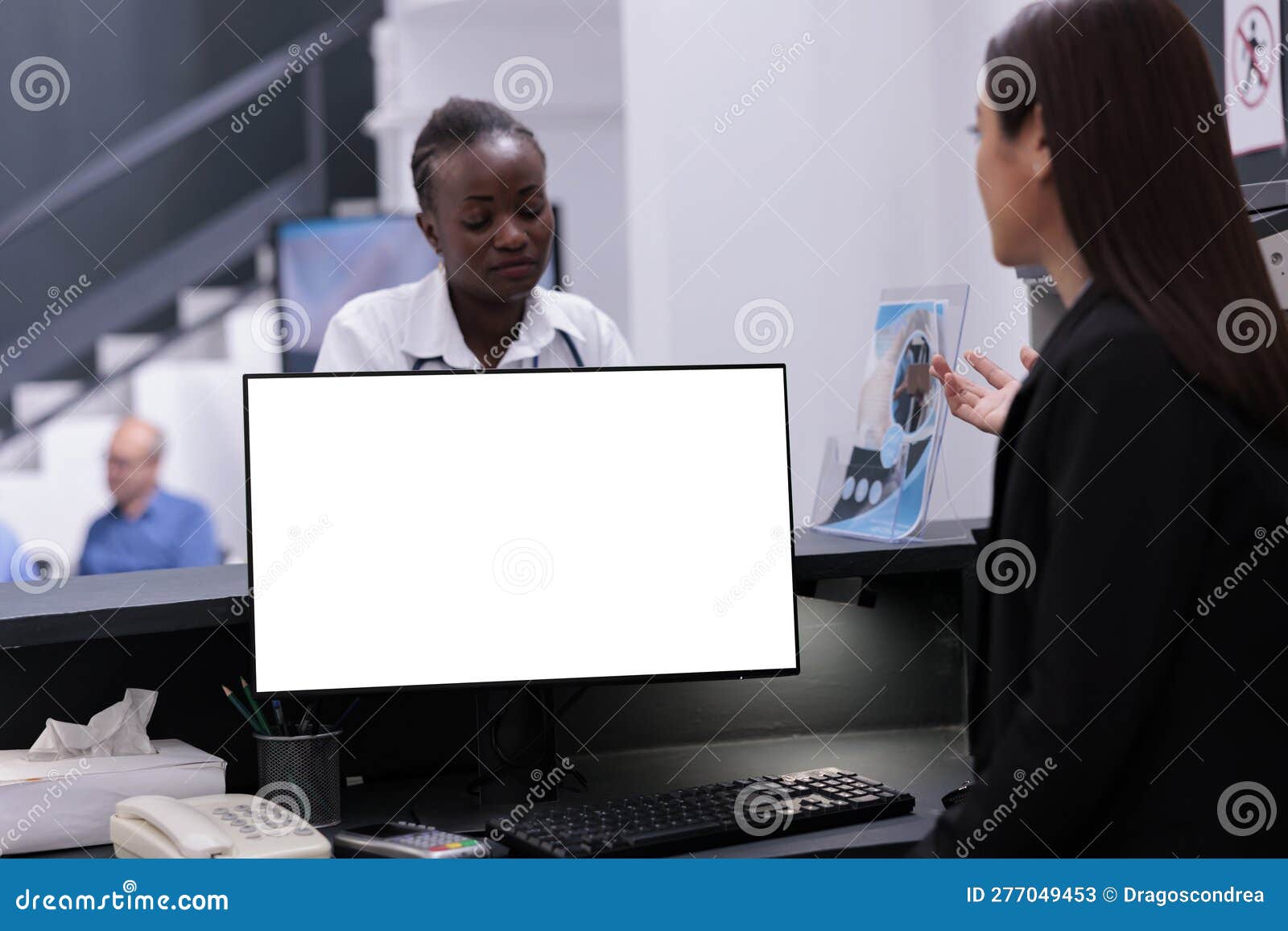 Asian Receptionist Using White Screen on Computer while Working at ...