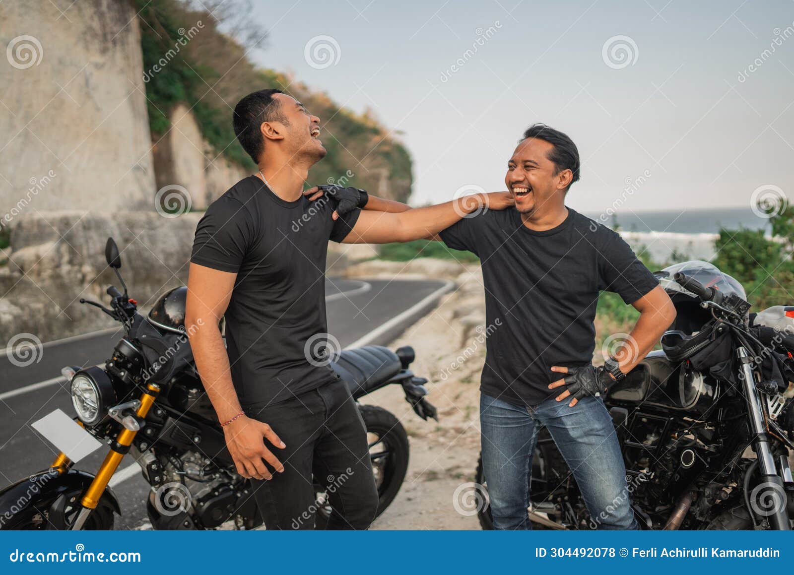 Asian Riders Standing beside Motorcycle Laughing Together Stock Photo ...