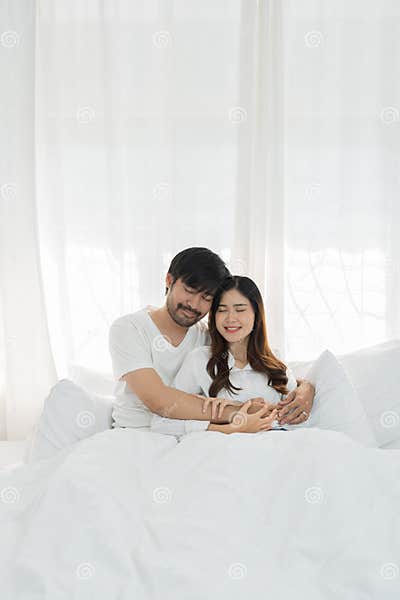 Asian Romantic Couple In Bed Enjoying Sensual Foreplay Happy Sensual Young Couple Lying In Bed