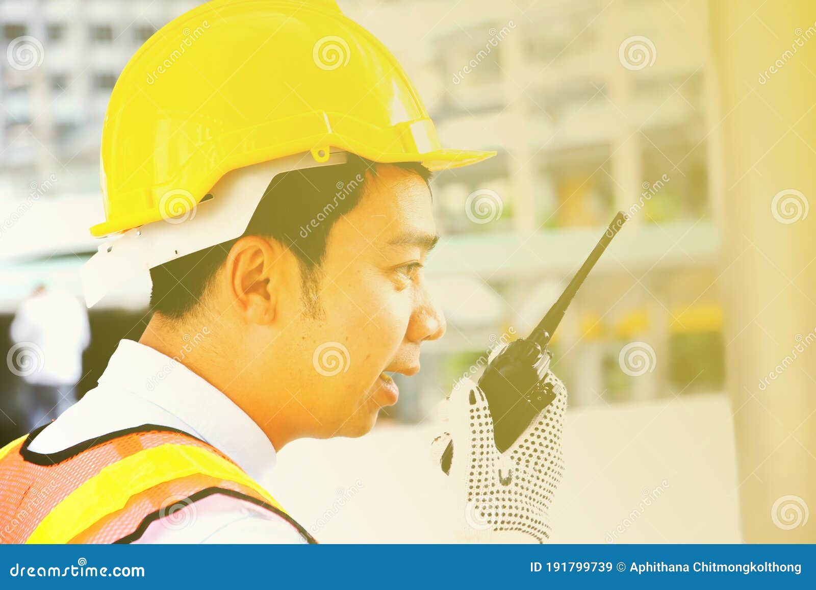 The Asian Safety Engineer Using Radio Talhing To Team Work in ...