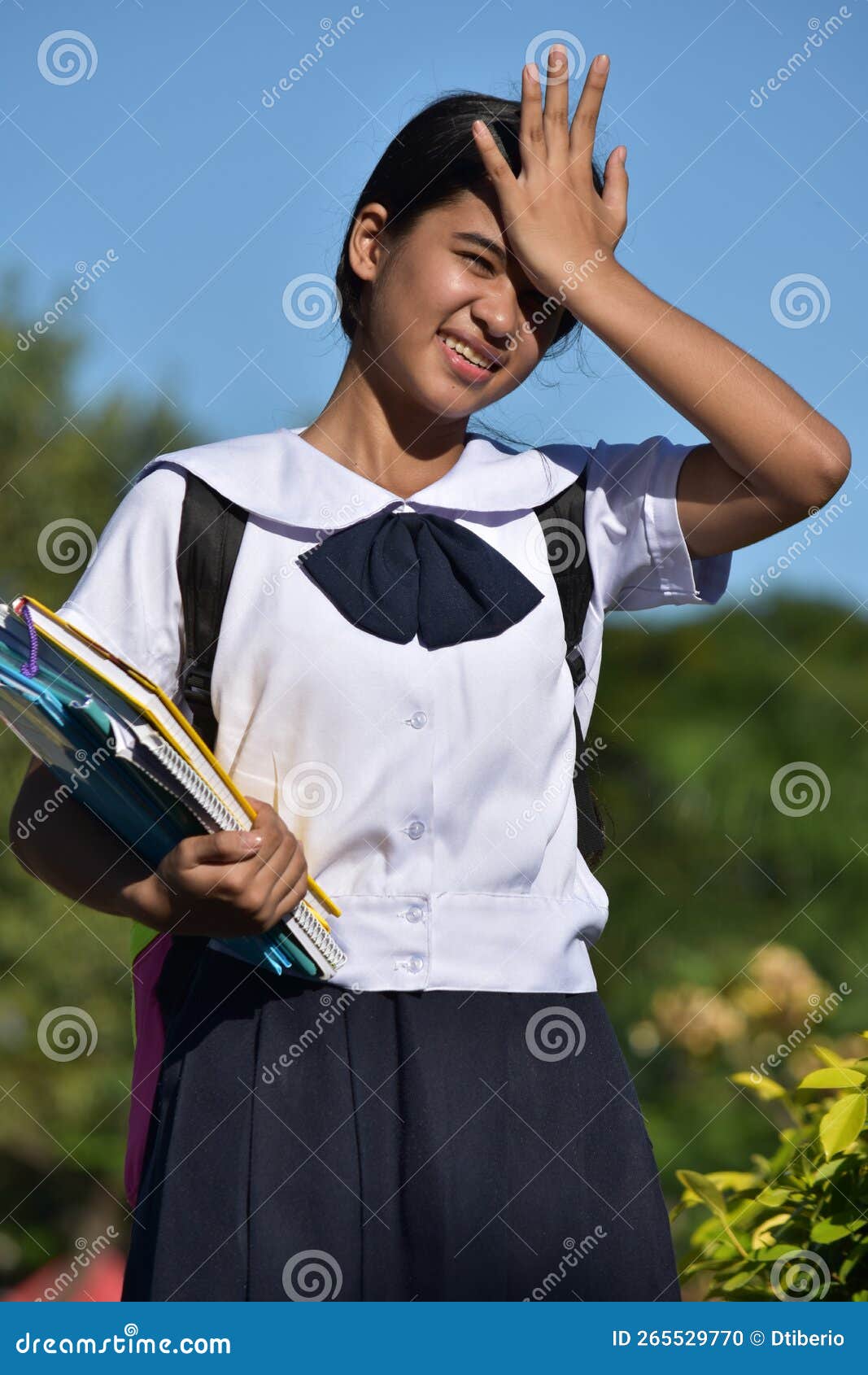 Asian School Girl Memory Problems Wearing School Uniform with Textbooks ...