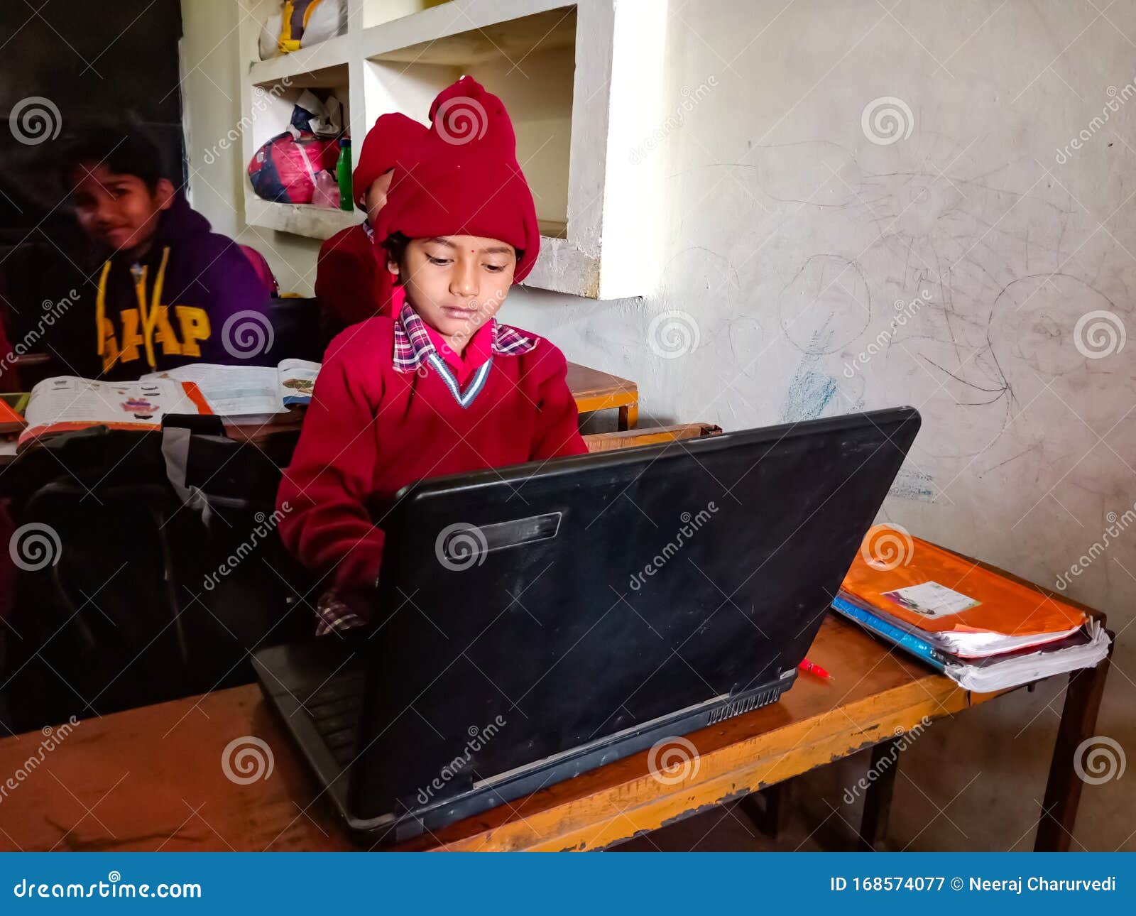 An Asian School Kid Operating Laptop Computer in the Classroom in India ...
