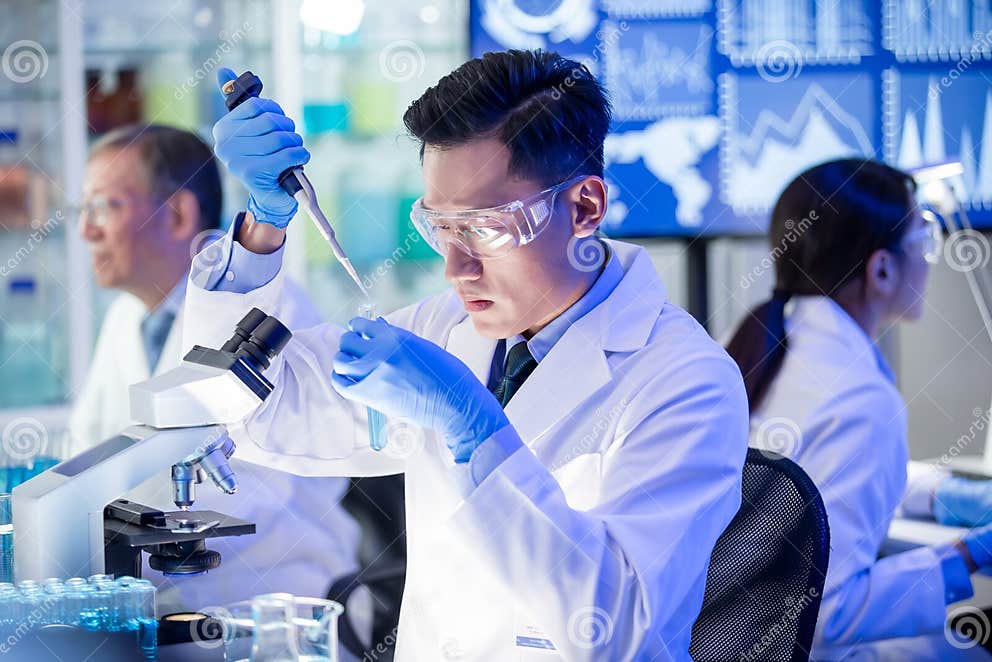 Asian Scientist Use Microscope Stock Photo - Image of expertise ...