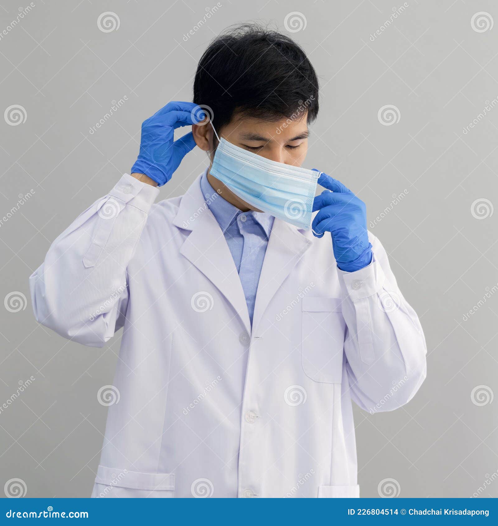 Asian Scientist Waring a Face Mask before Beginning the Experiment in a ...