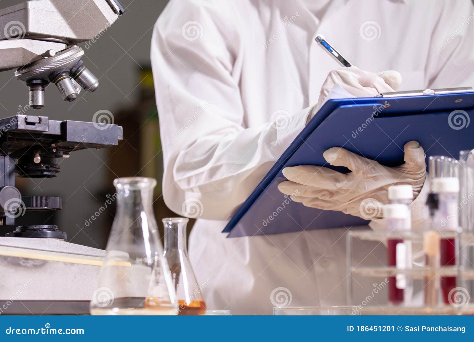 Scientist is Writing Data after Analysis and Research Chemical Test in ...