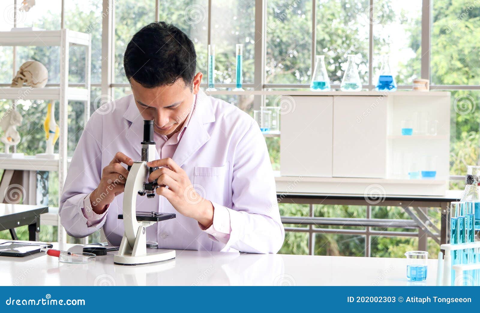 Asian Scientists or Chemists Use a Microscope Stock Image - Image of ...