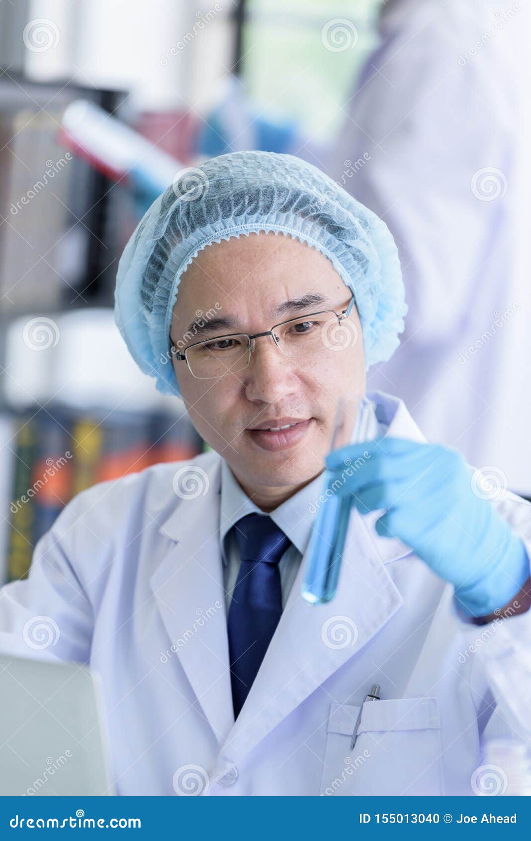 Asian Senior Scientist Male Researching and Learning in a Laboratory ...
