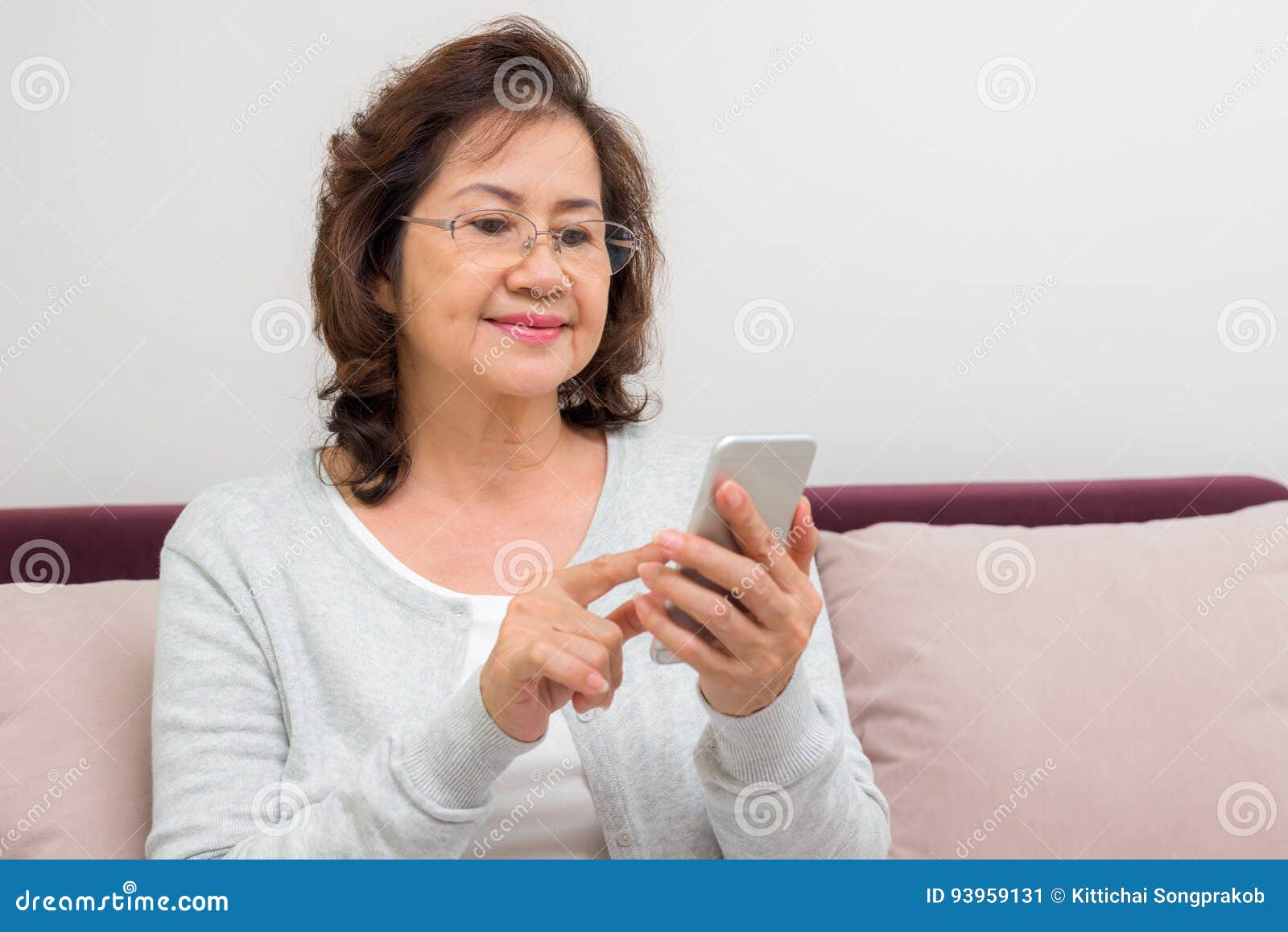 Asian Senior Woman Looking through Her Contacts Stock Image - Image of ...