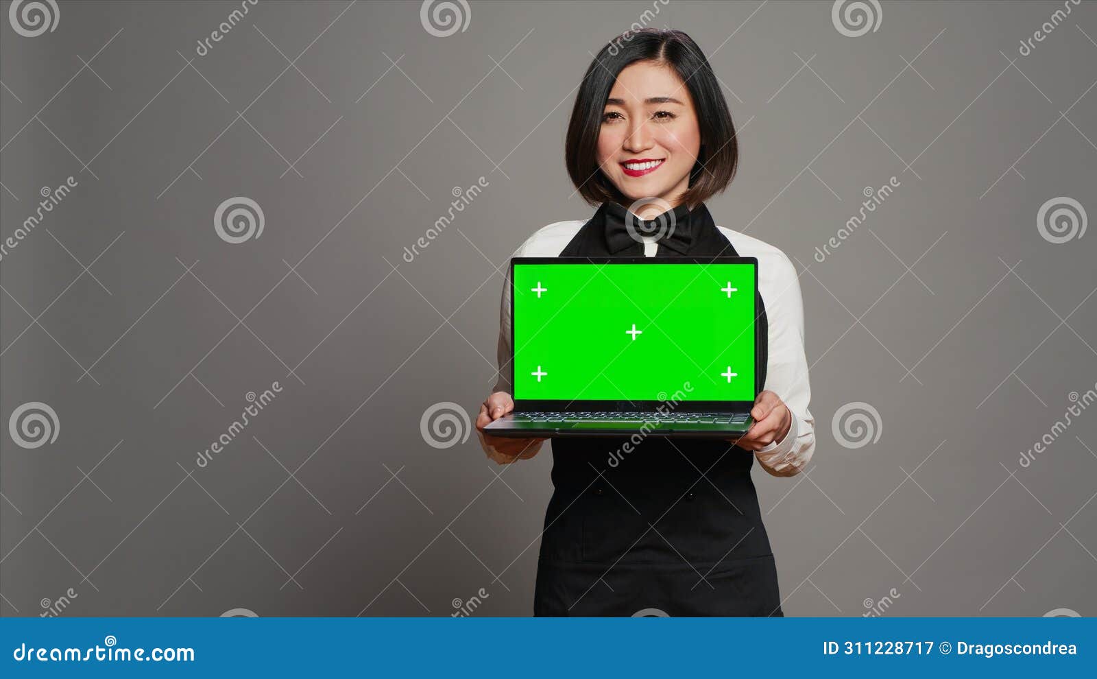 Asian Server Presenting Greenscreen Display on Laptop in Studio Stock ...