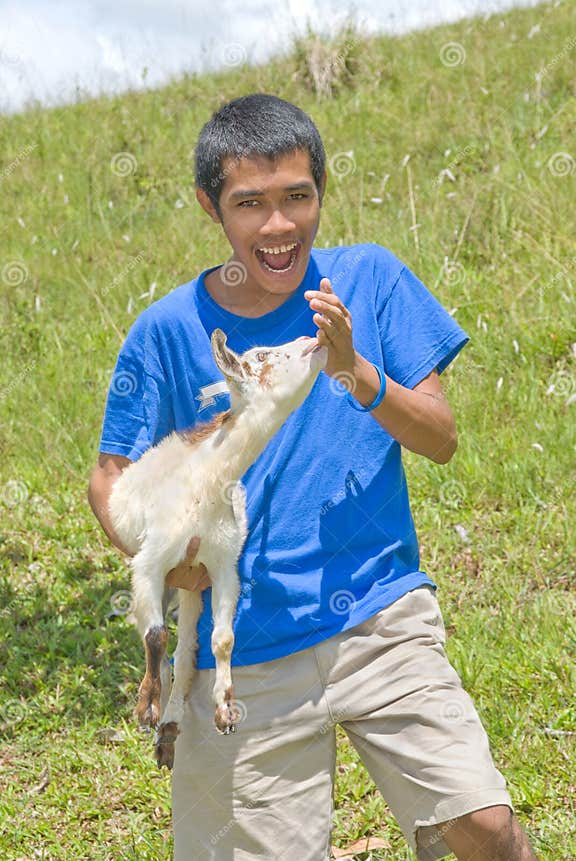 Asian Shepherd with Young Goat Stock Image - Image of asia, minority ...