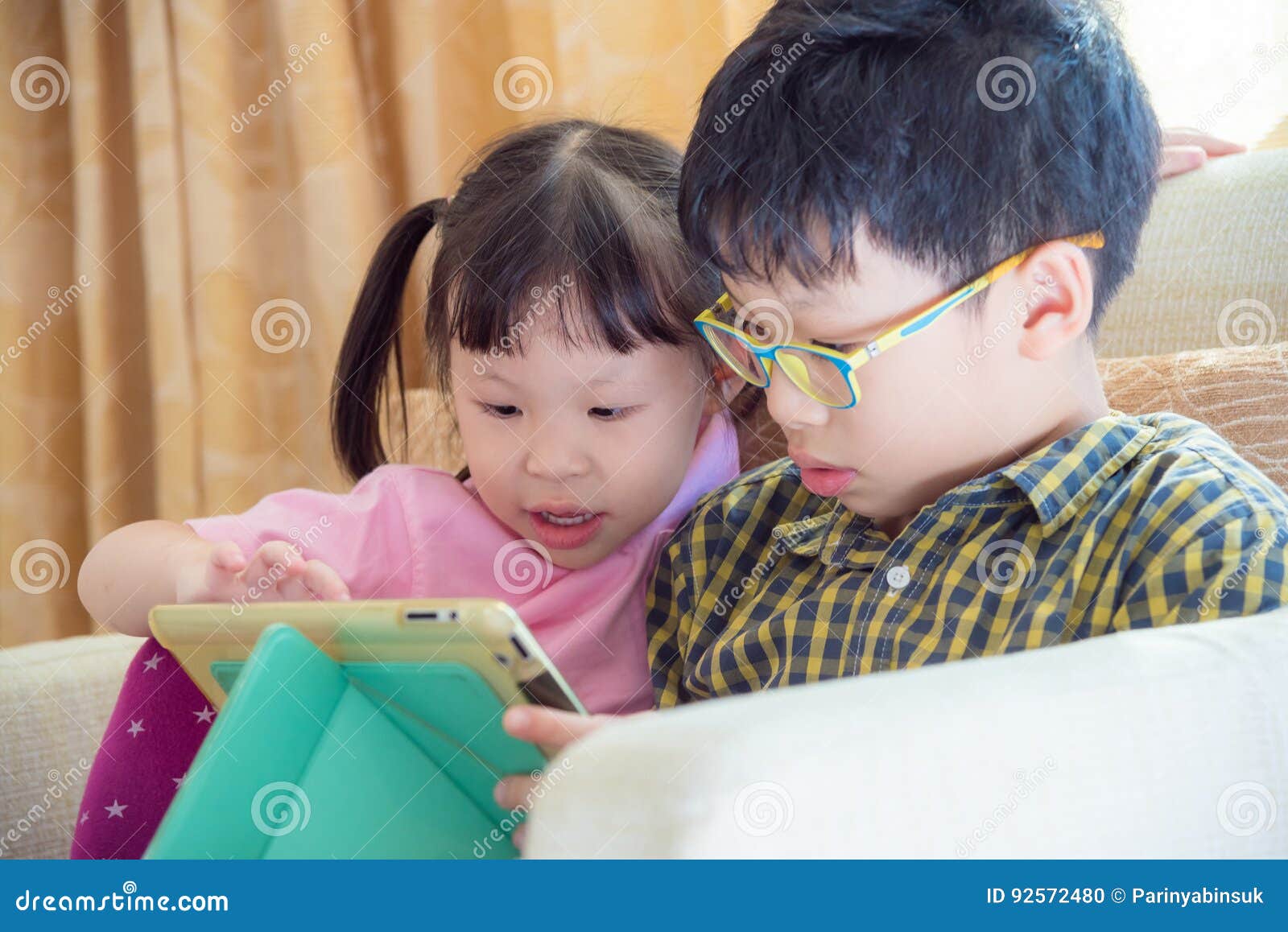 Siblings Playing Games on Tablet Computer Stock Photo - Image of games ...