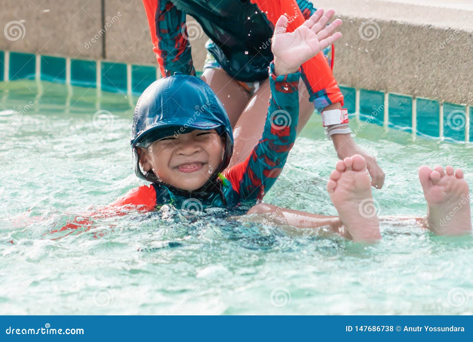 Asian Siblings Swimming and Chasing in Swimming Pool Stock Photo ...