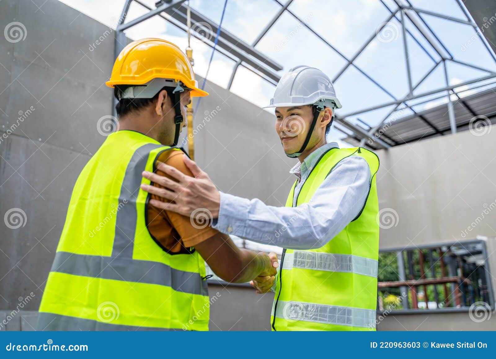 Asian Structure Engineer and Worker Making Handshake on Building ...