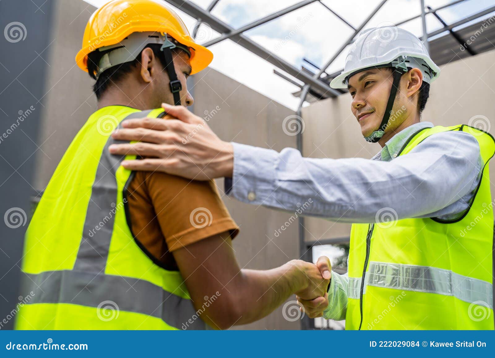 Asian Structure Engineer and Worker Making Handshake on Building ...