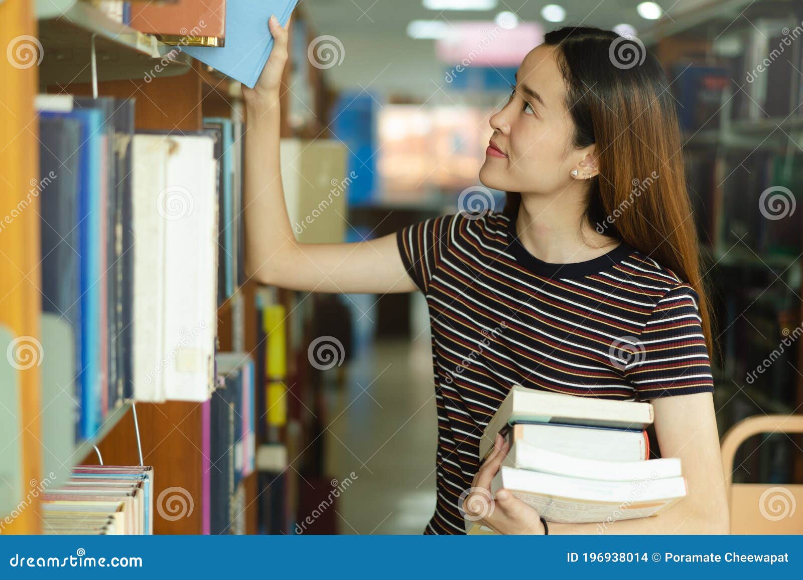 Student Choosing Book in the Shelf in Library Stock Photo - Image of ...