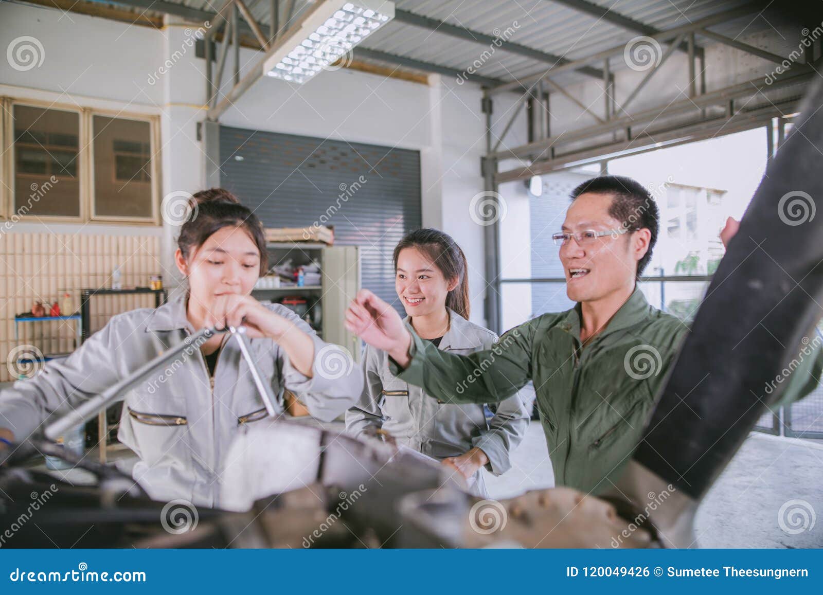 Asian Student Engineers and Technicians are Repairing Aircraft O Stock ...