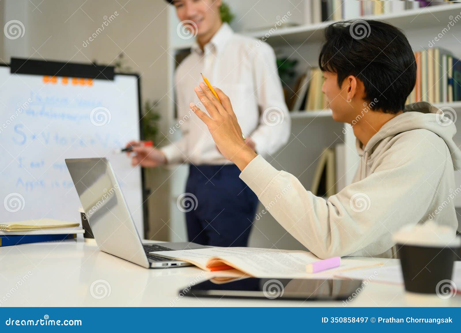 Asian Student Man Asking a Question while Tutor Explaining Something on ...