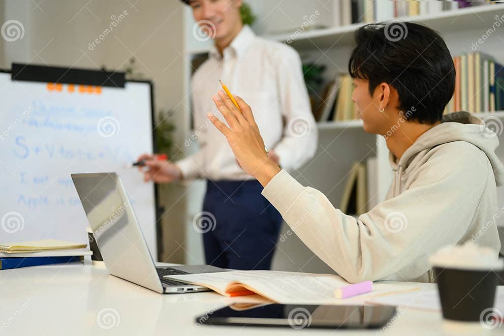 Asian Student Man Asking a Question while Tutor Explaining Something on ...