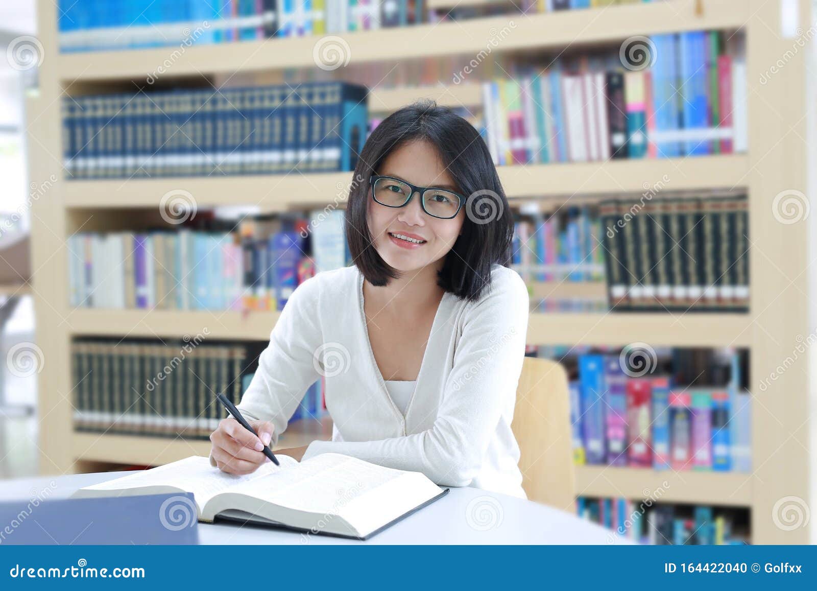 Asian Student Reading Book in the Library at University Stock Photo ...