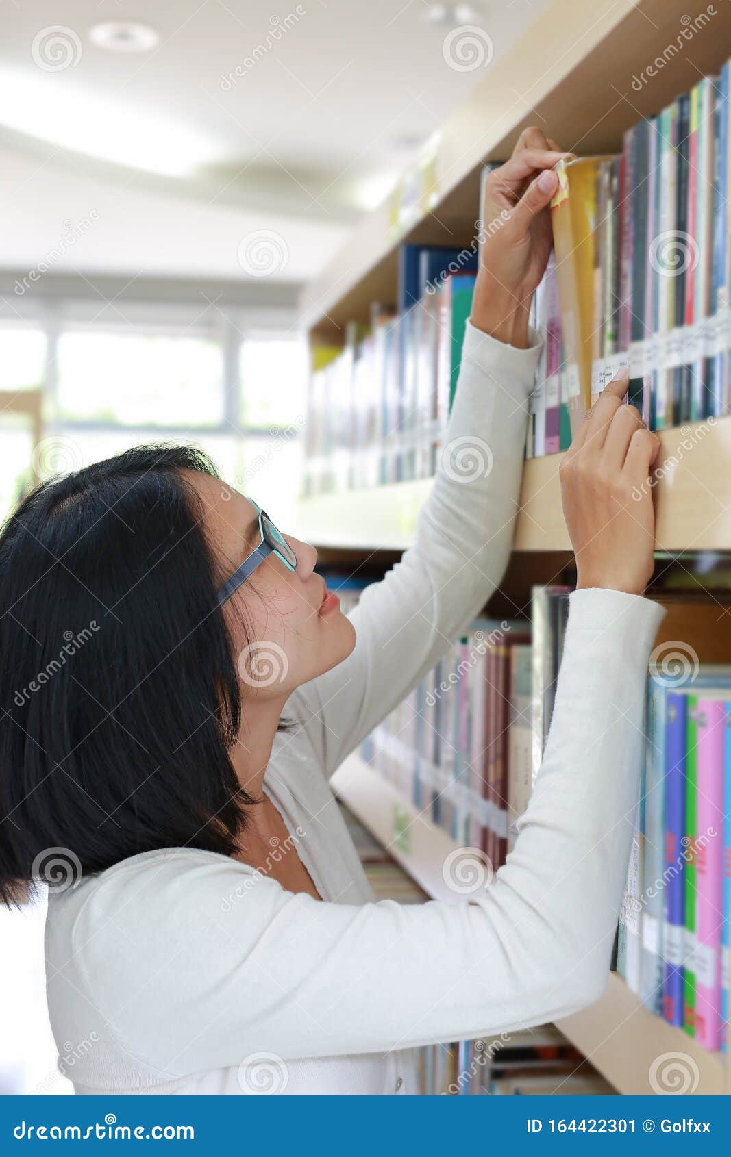Asian Student Researching on the Study in the Library Stock Image ...