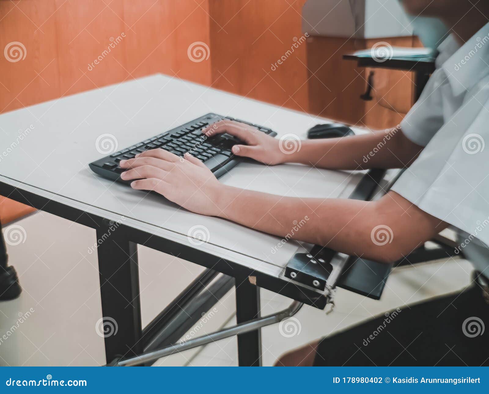 Asian Student Typing on Wireless Keyboard in Classroom Stock Photo ...