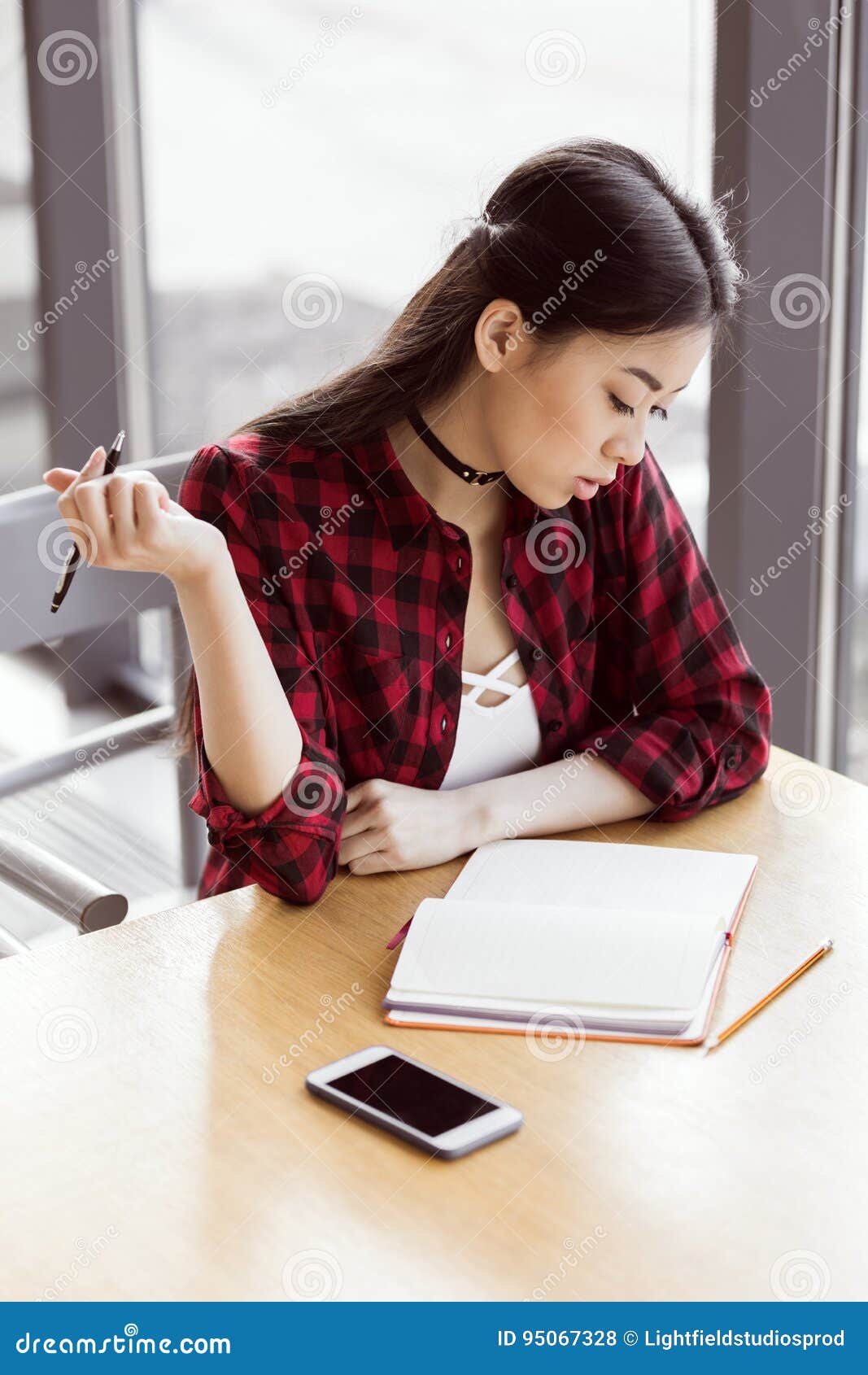 Asian Student Writing in Diary and Sitting in Cafe Stock Photo - Image ...