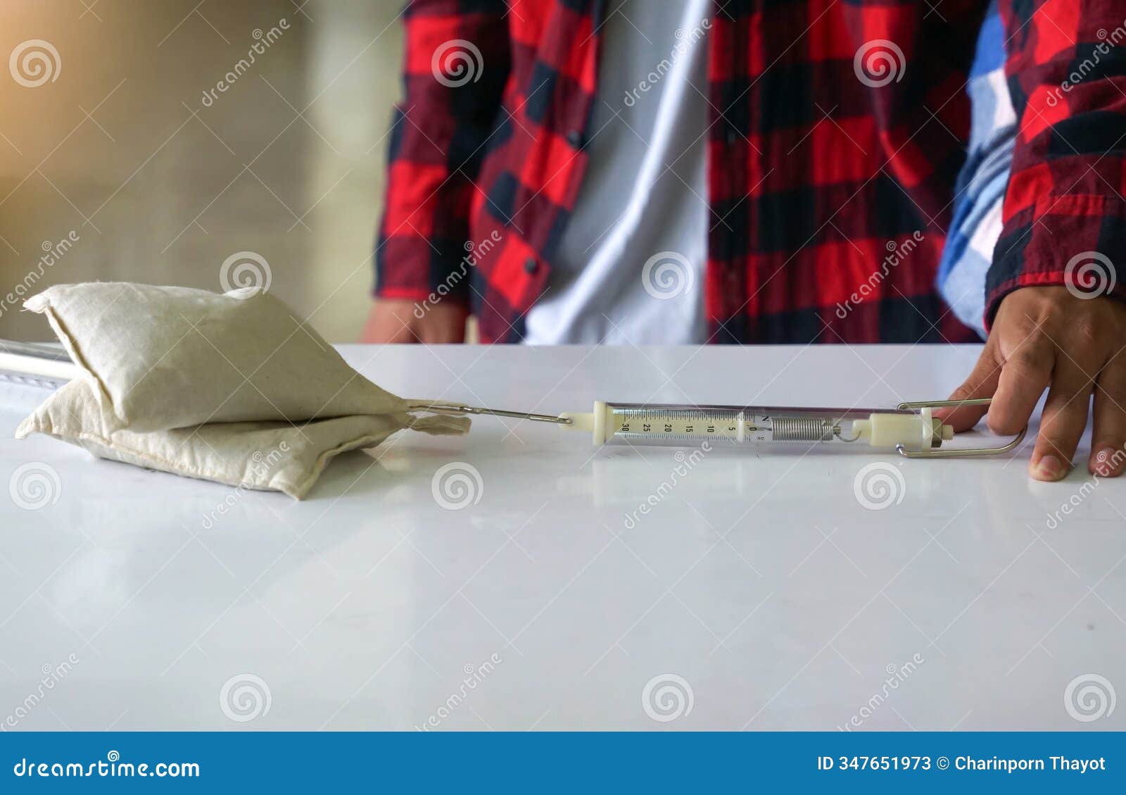 Asian Students Conduct Experiments on Friction Using a Spring Scale ...