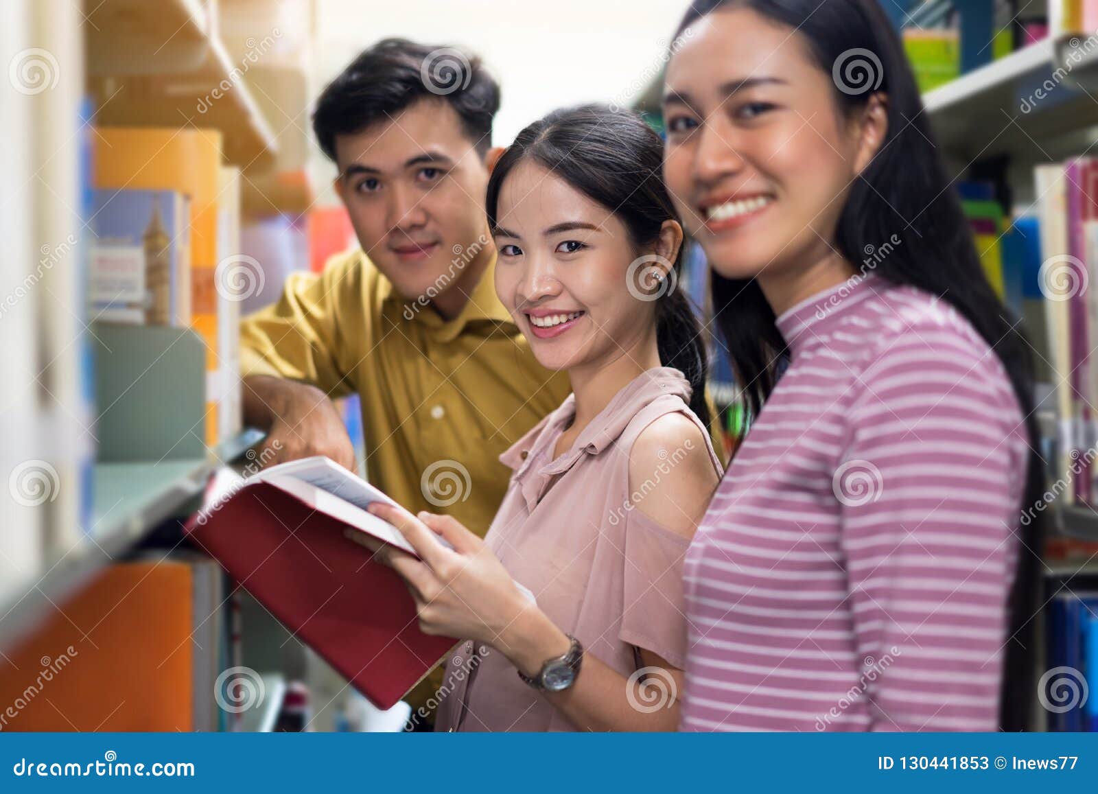 Asian Students Group Reading Book in Library, Learning and Education ...
