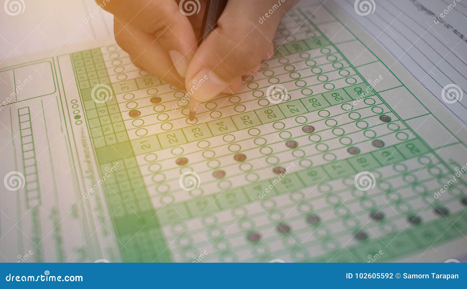 Asian Students Holding Pencil in Hand Doing Multiple-choice Quiz Stock ...